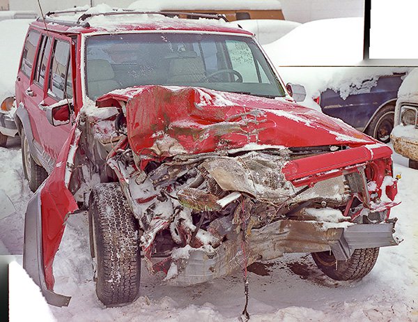 Damaged Red Car